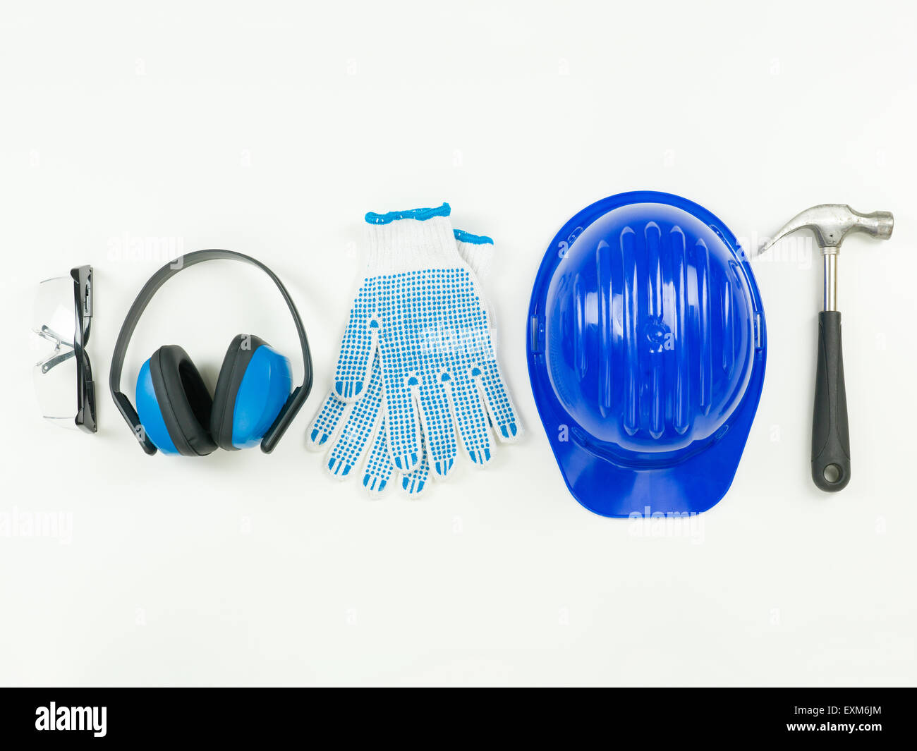 top view of construction tools and protective equipment aligned in a ...