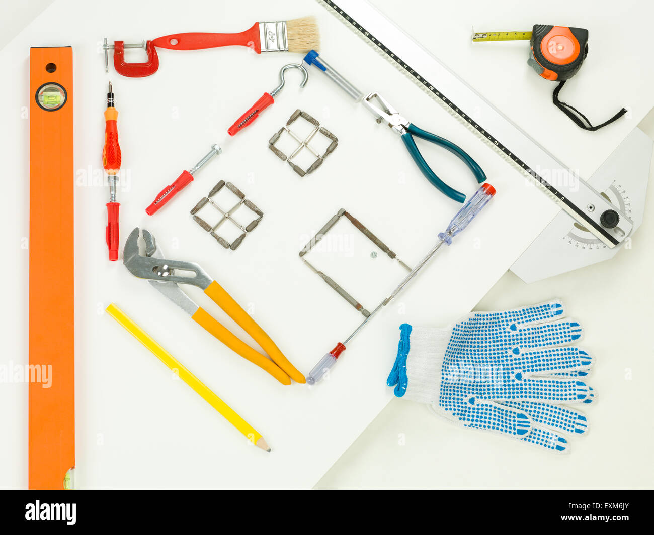 shape of house made with household and construction tools, on white ...