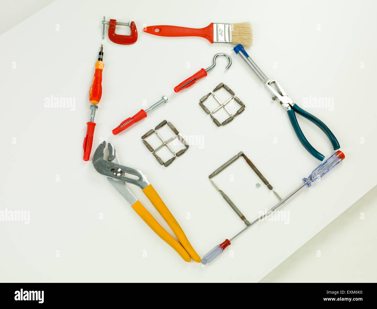 outline of house made with household and construction tools, on white ...