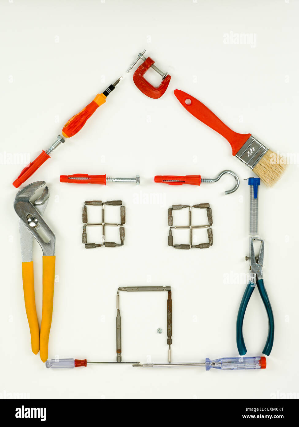 outline of house made with household and construction tools, on white ...