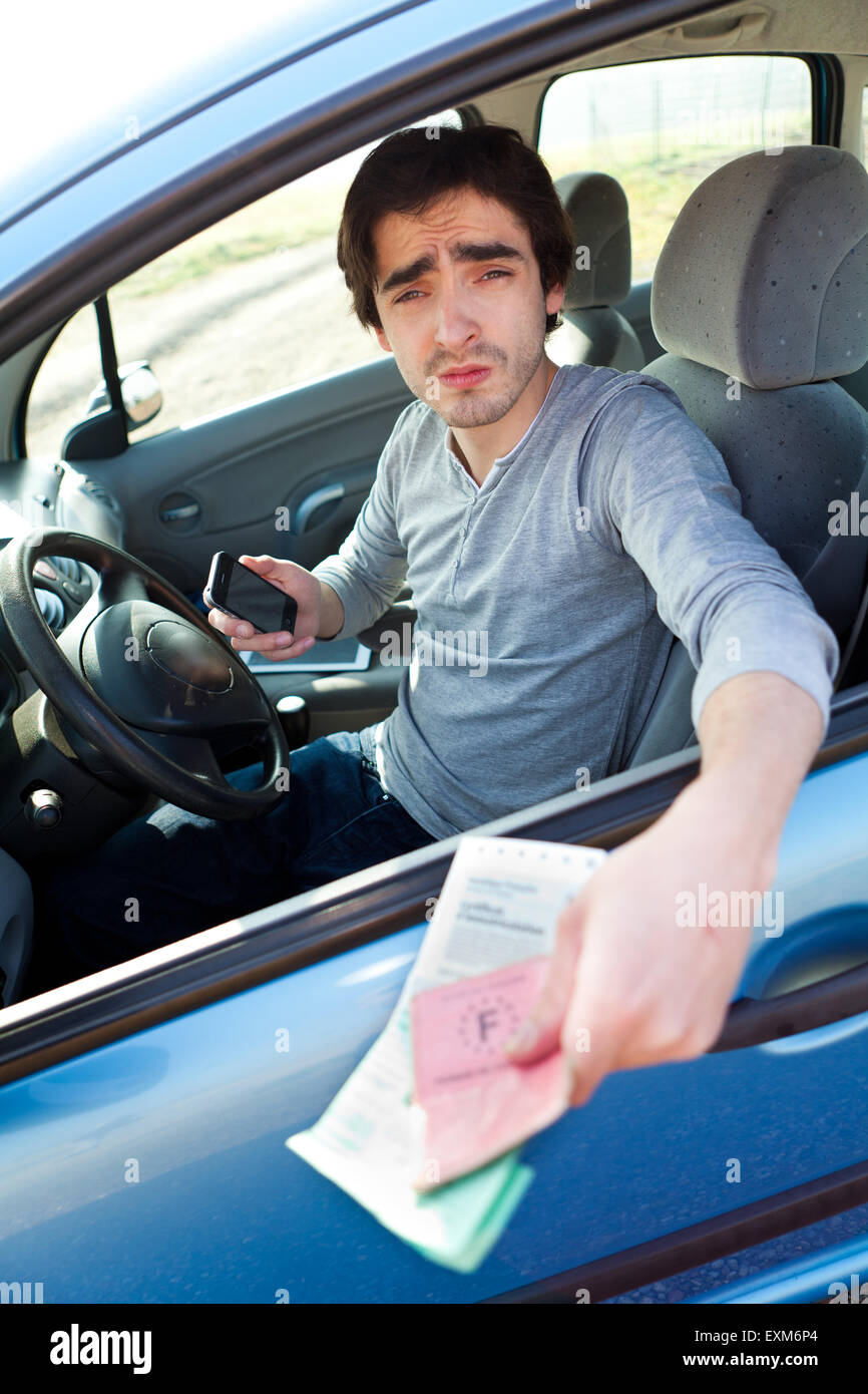View of a Young man presenting papers at a routine check Stock Photo ...