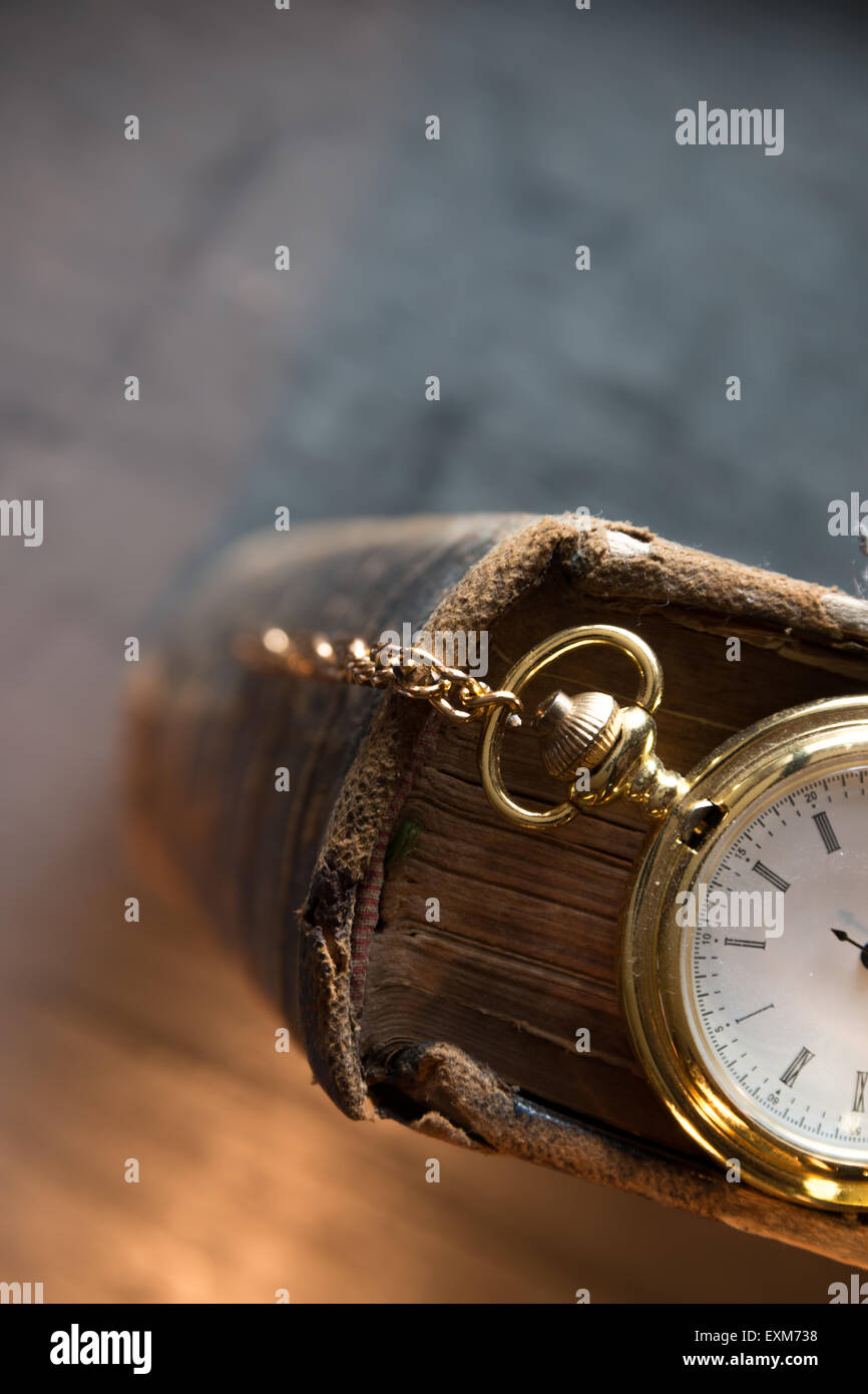 Vintage pocket watch and old book, symbols of time with copy space ...
