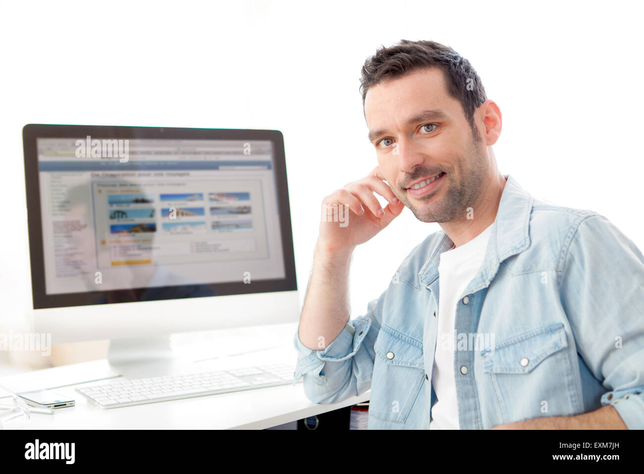 View of a young relaxed man using computer Stock Photo - Alamy