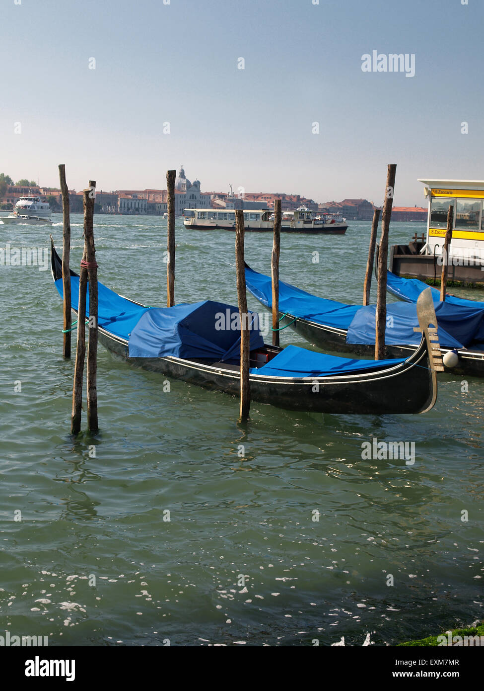 Gondolas Docked On The Grand Canal Near San Marco With St Giorgio In