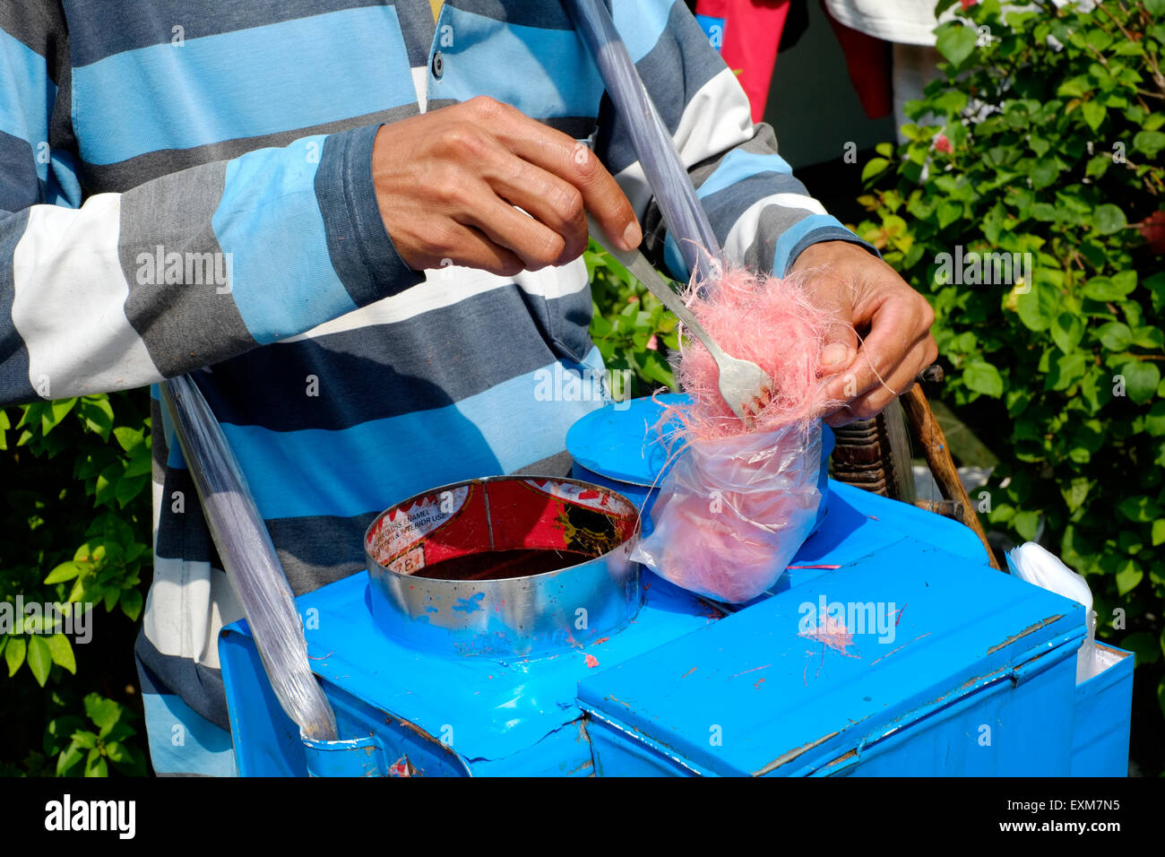 street vendor selling candy floss in a rural village near malang java ...