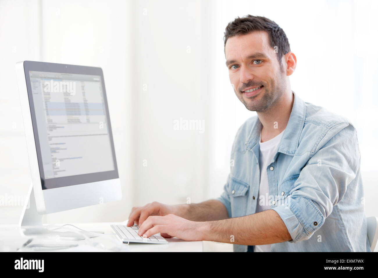 View of a young relaxed man using computer Stock Photo - Alamy