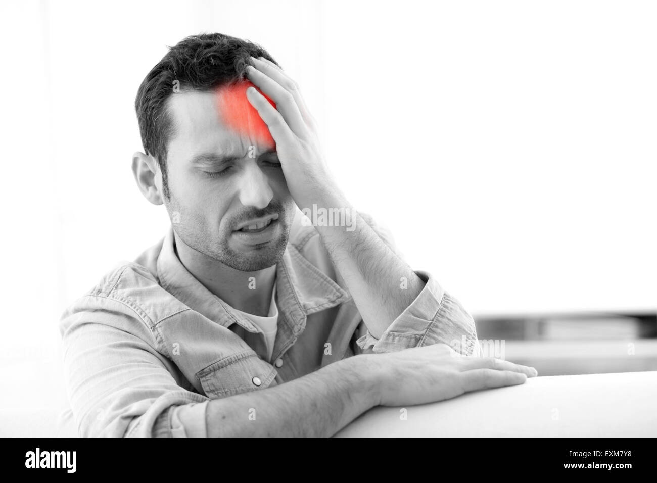 View of Young attractive man with a headache Stock Photo - Alamy