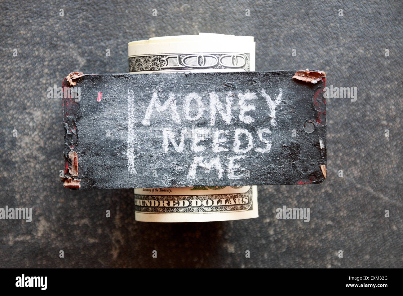Money needs me concept. The inscription in chalk and dollars Stock ...
