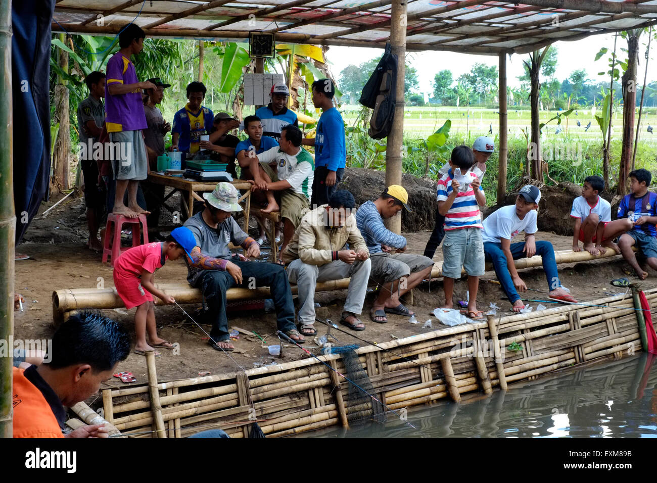 fishing indonesian style at a popular rural village man made pool near ...