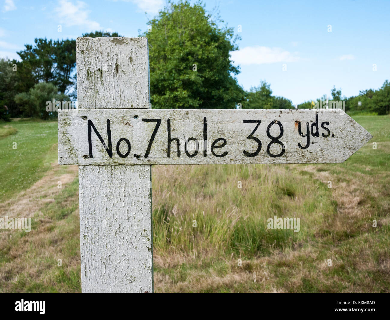 A signpost and direction arrow to the 7th or number seven hole on a ...