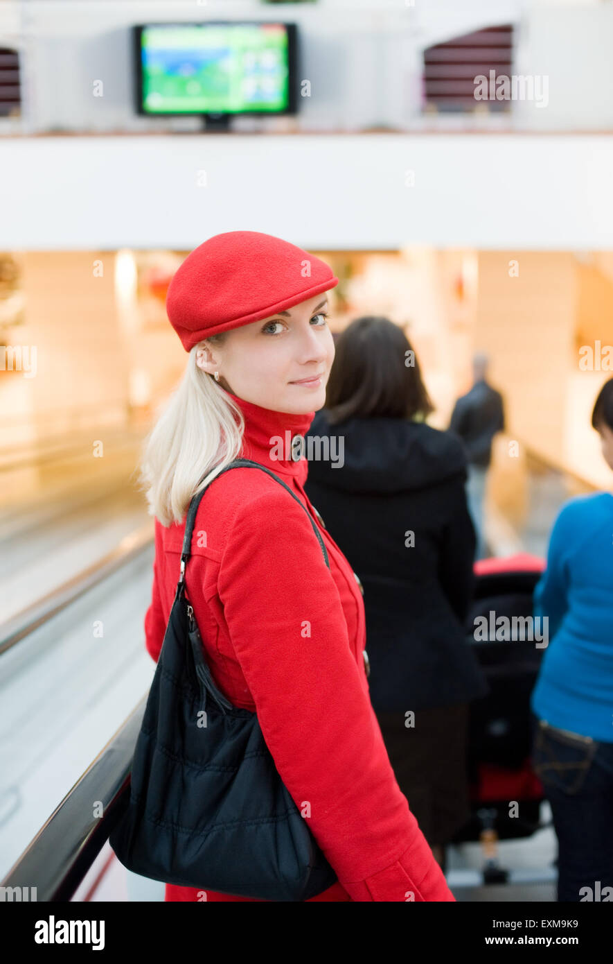 Young woman on elevator Stock Photo - Alamy