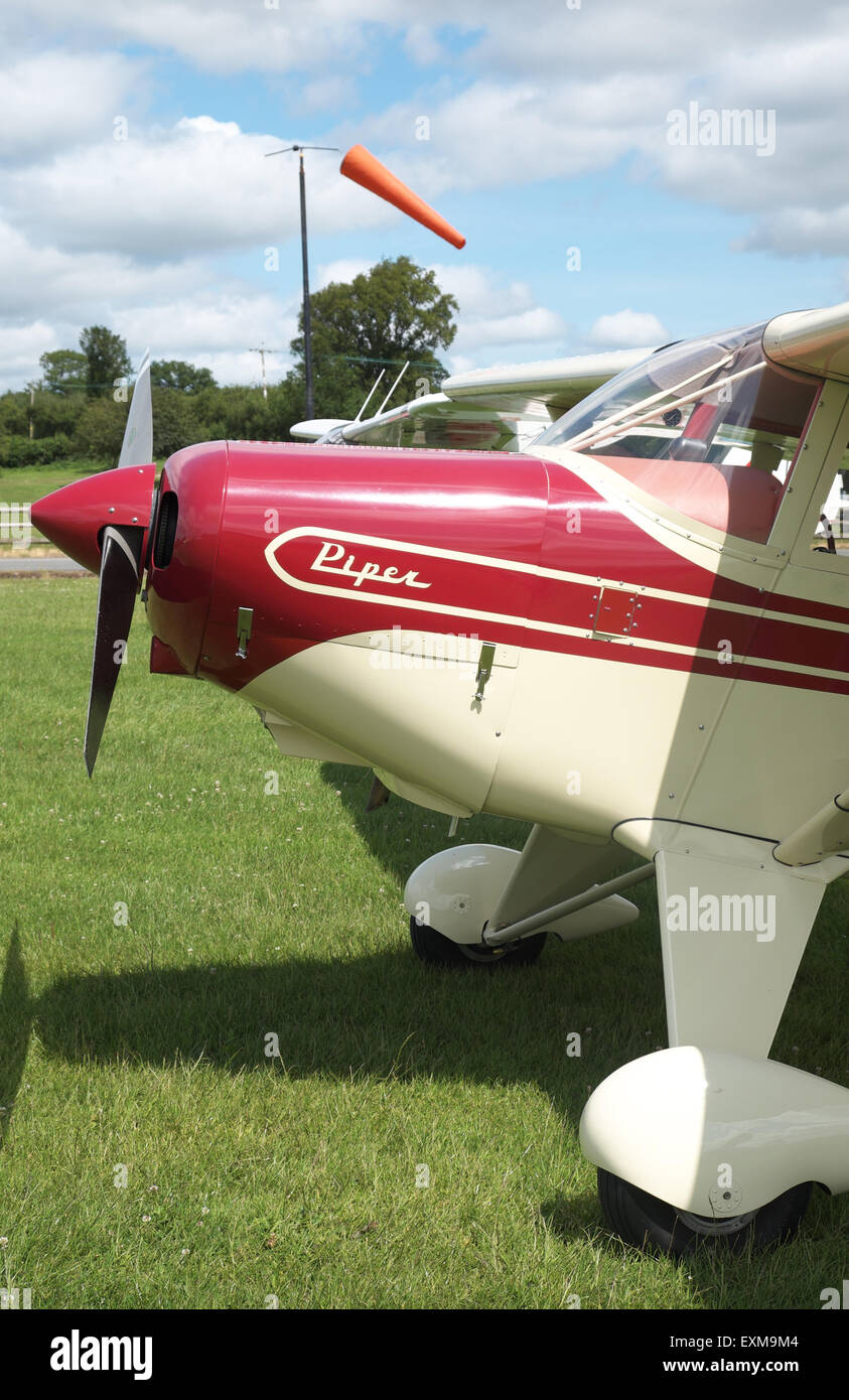 Vintage Piper Pa-22 light aircraft built in the 1950s at a grass ...
