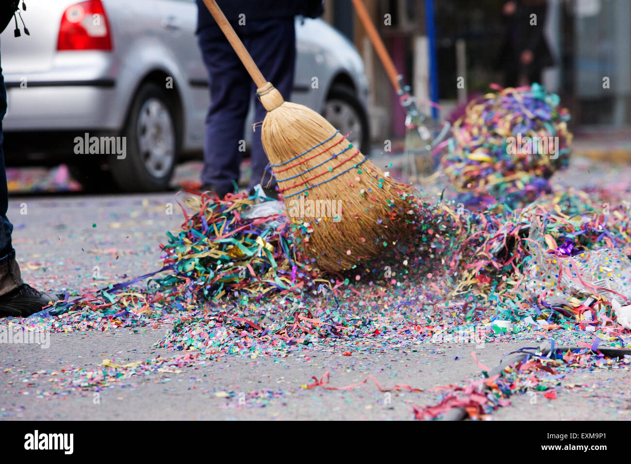 Sweepers with brooms cleaning the colourful rubbish/ dirt from the ...