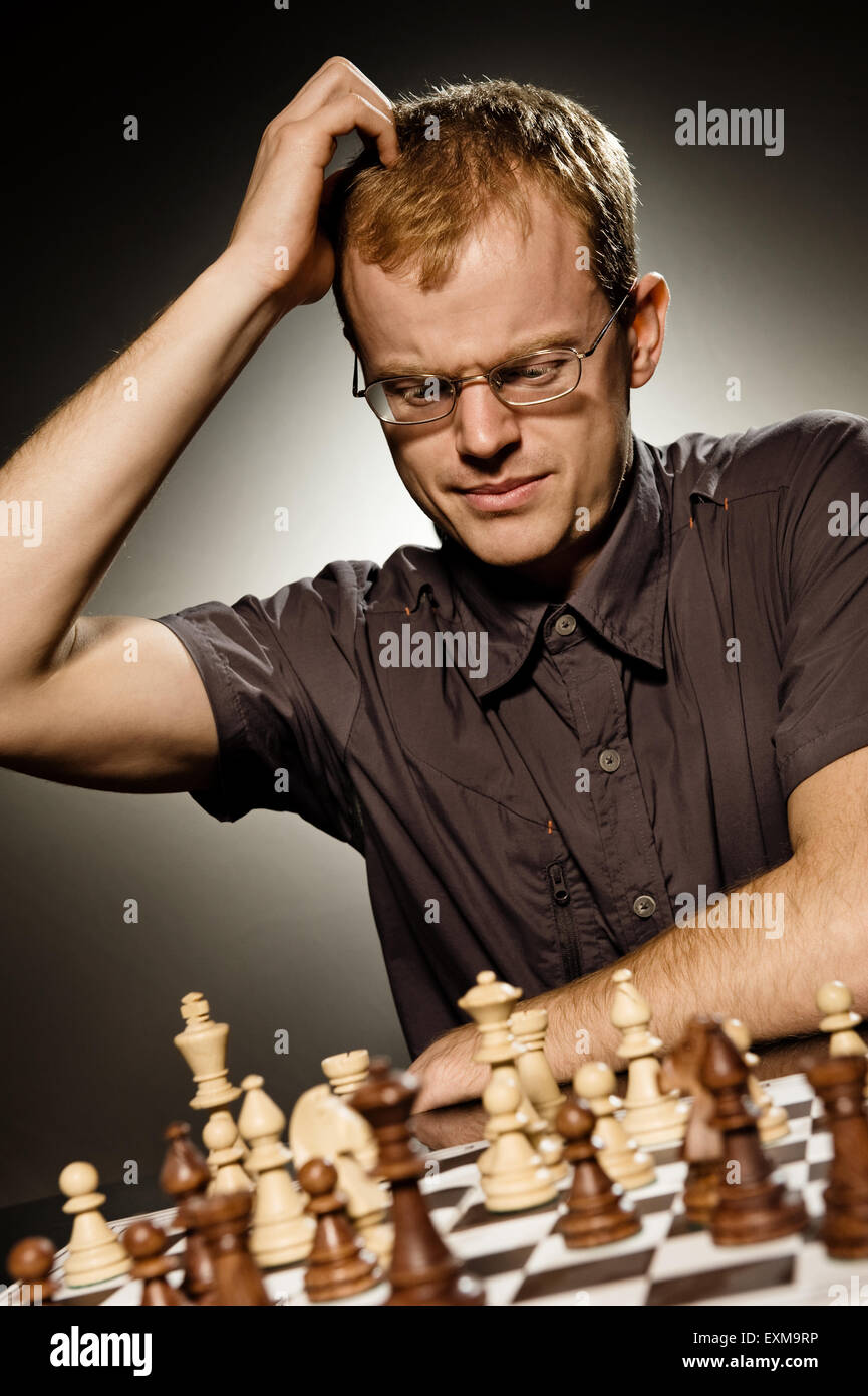 Thoughtful chess master Stock Photo - Alamy