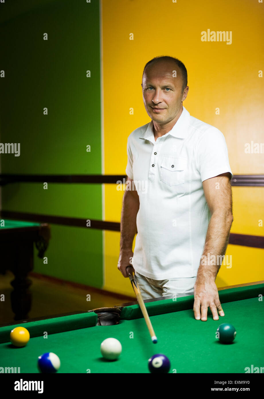 Man playing billiards Stock Photo - Alamy