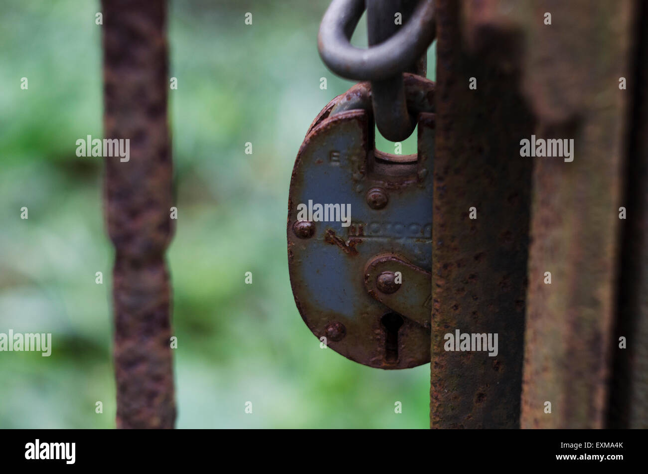 A rusty padlock on the gate Stock Photo - Alamy
