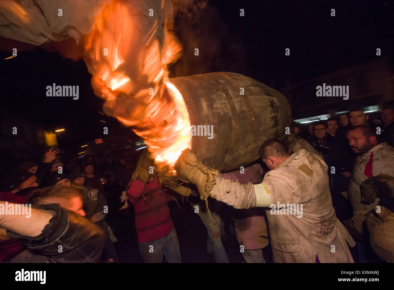 Large men's barrel being carried through crowds in the square to mark ...