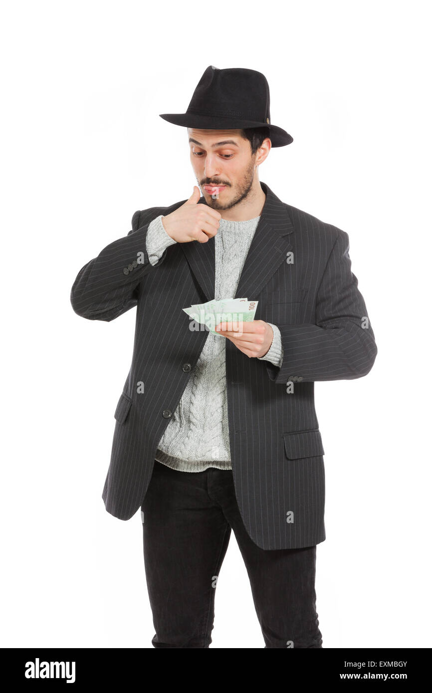 young man with hat counts the money, isolated over white background ...
