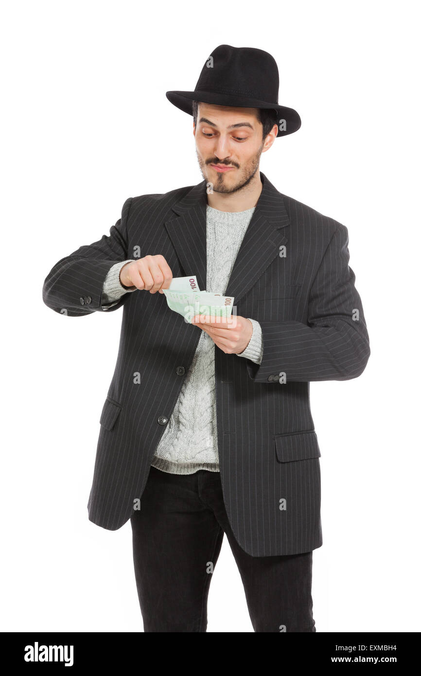 young man with hat counts the money, isolated over white background ...