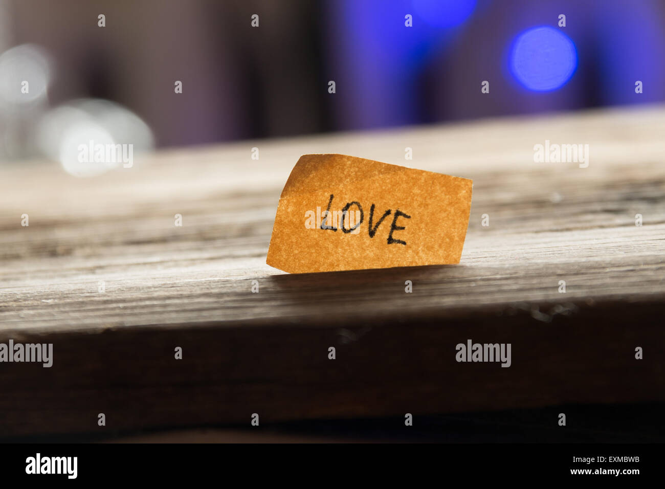 lettering love, label on a wooden table Stock Photo - Alamy
