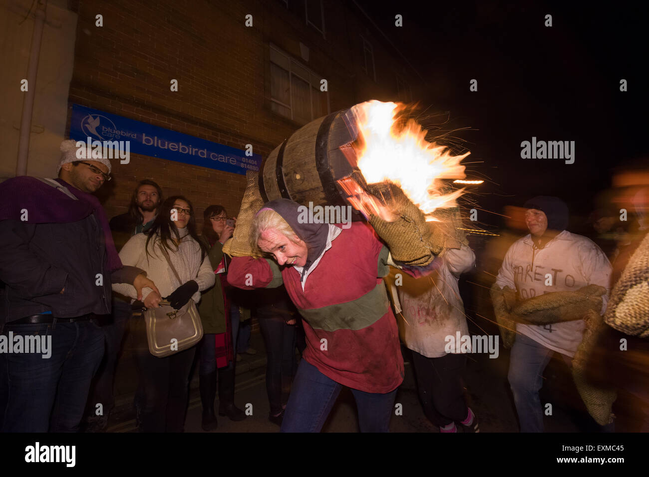 Woman carrying one of the Ladies Barrels to mark Bonfire Night, 5 ...