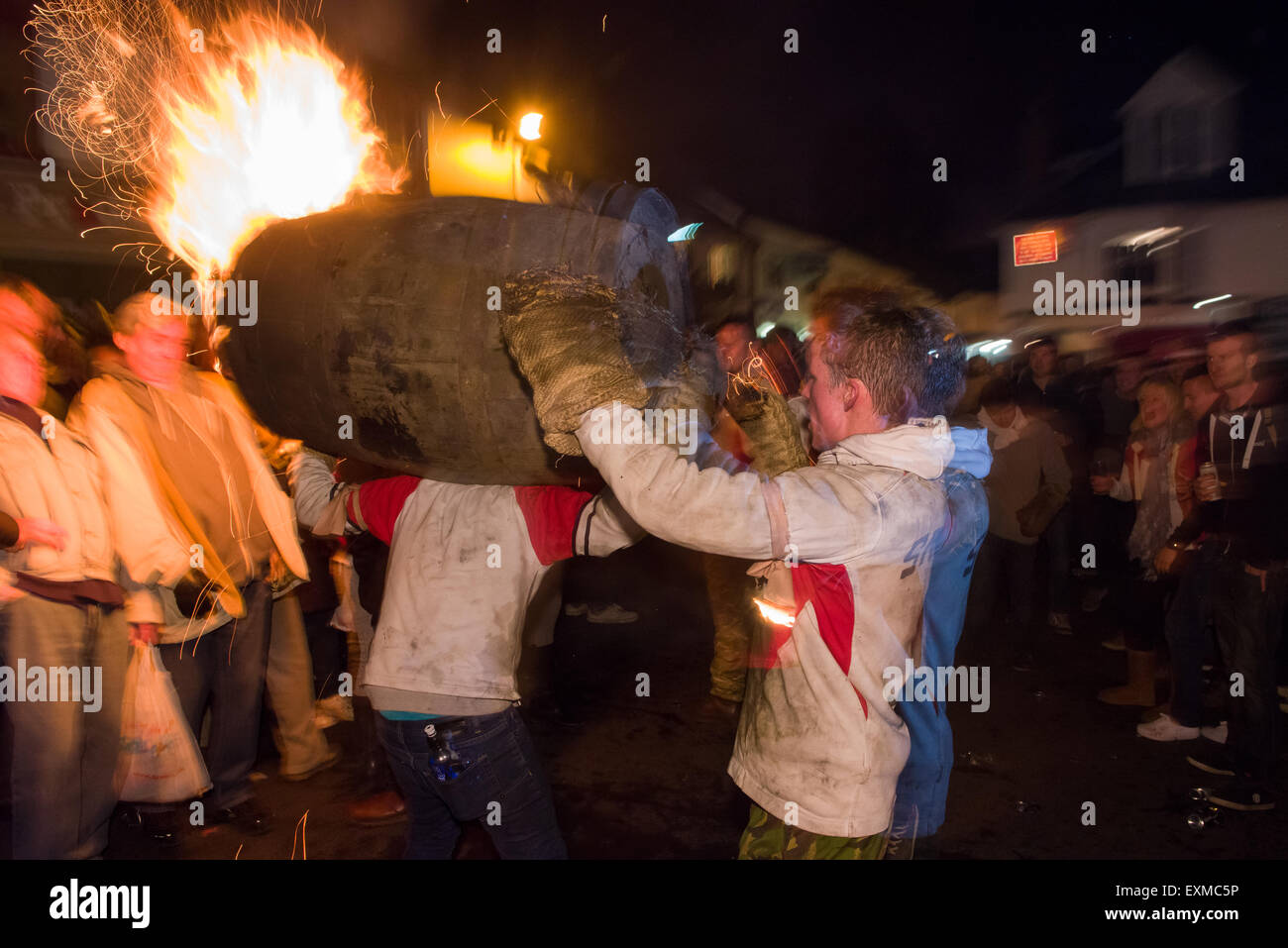 Group of youths carrying an Intermediate burning barrel through the ...