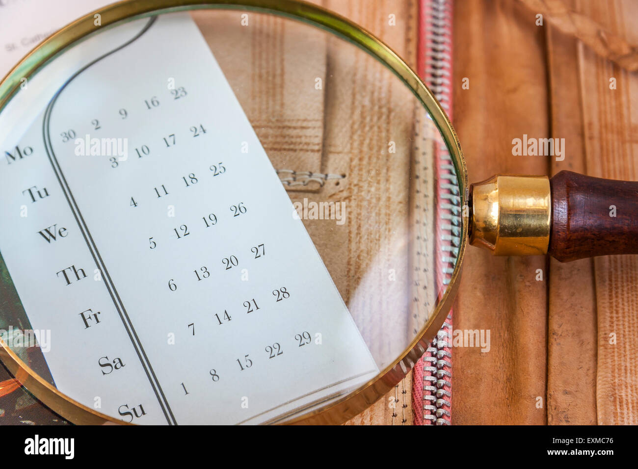 Magnifier Lying On The Calendar Close Up Stock Photo - Alamy