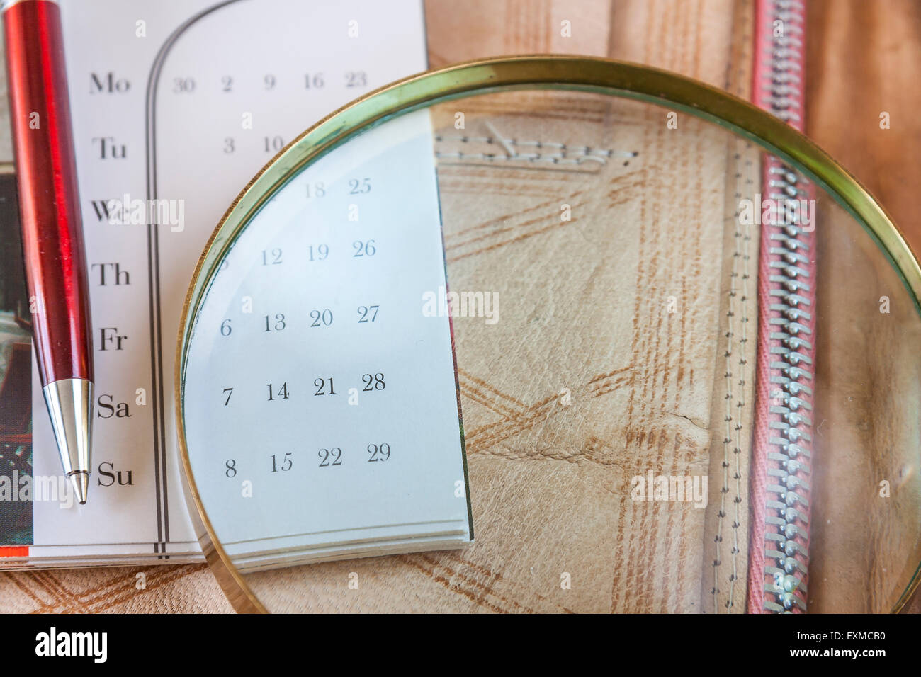 Magnifying calendar hi-res stock photography and images - Alamy