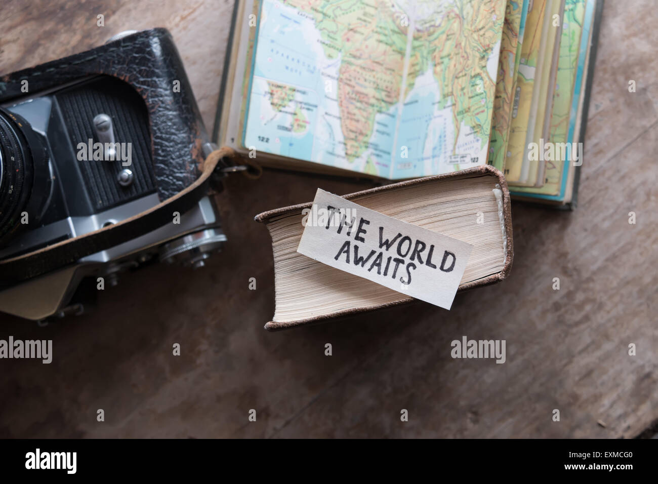 text "The World Awaits" and book, travel, tour,tourism concept Stock ...