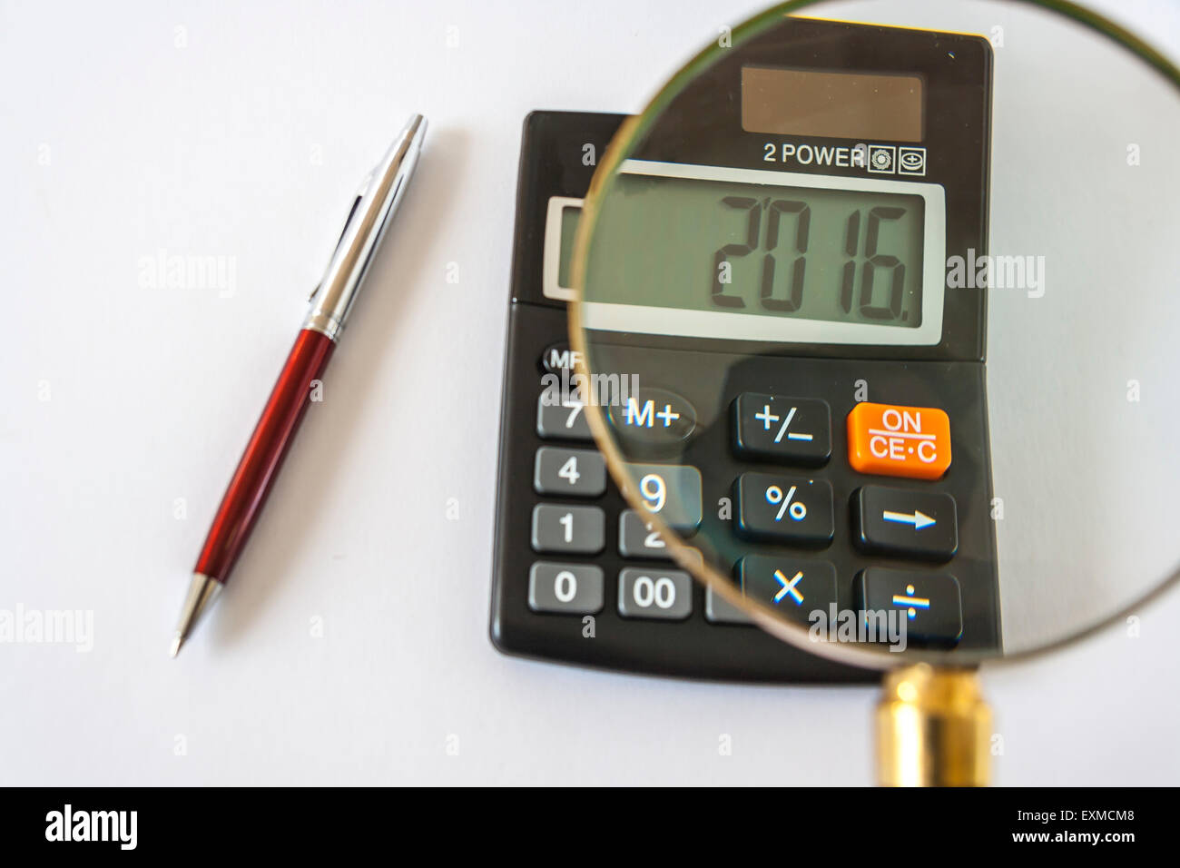 Magnifying glass calculator hi-res stock photography and images - Alamy