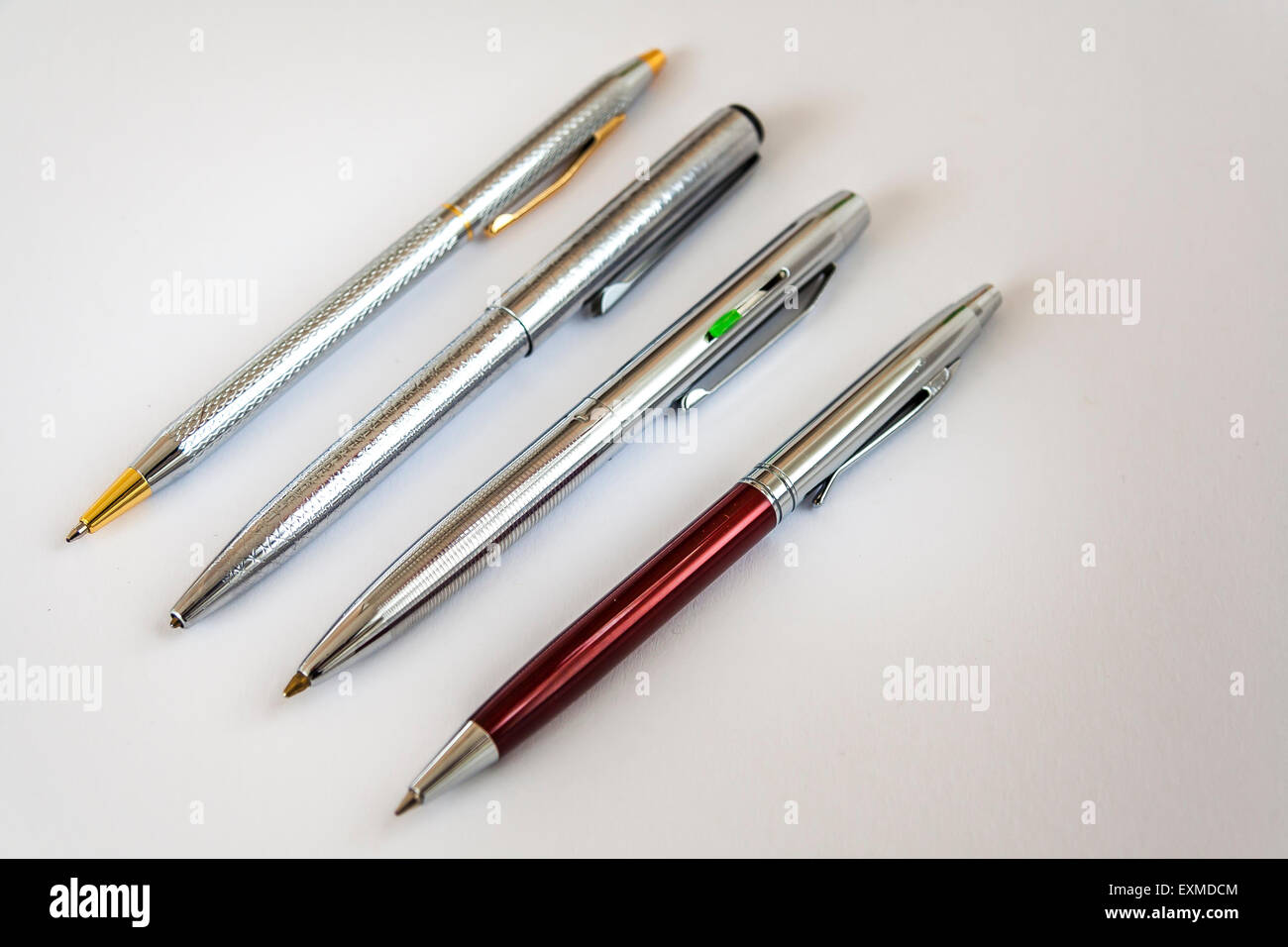 Four Ballpoint Pens On White Background Stock Photo - Alamy