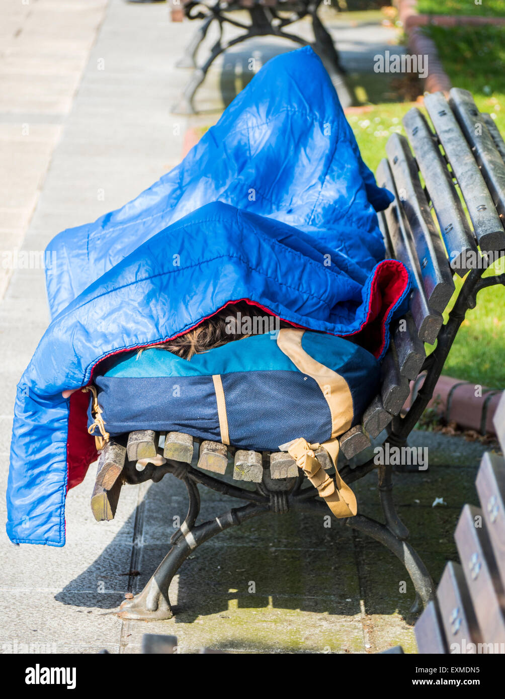 A tourist resting at promenade bench Stock Photo - Alamy