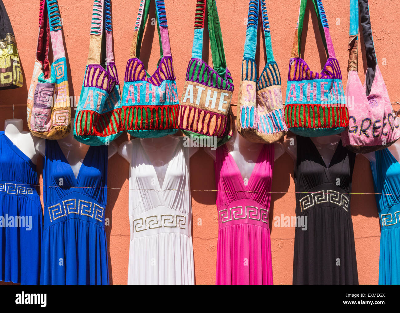 Greek bags and dresses hanging on a wall outside a shop in Athens ...