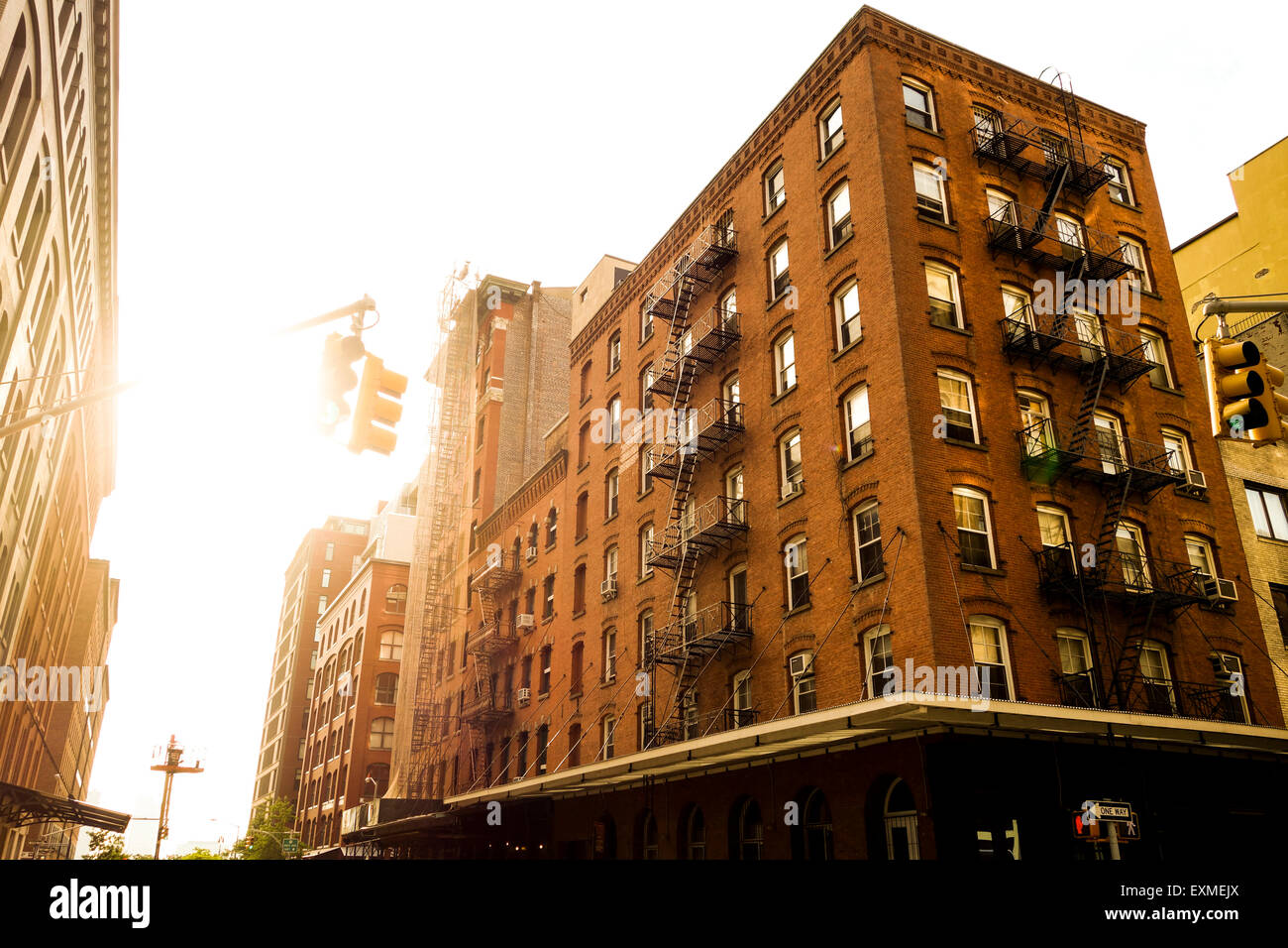 Facade of typical New York building next to High line park, brownstone ...