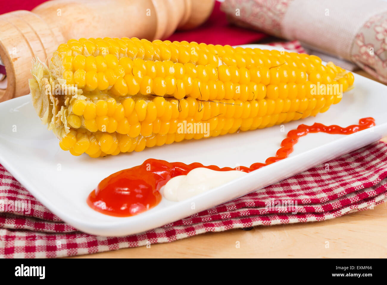 corn cob boiled served with mayonnaise and ketchup Stock Photo - Alamy