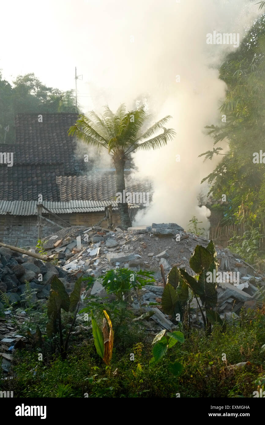 thick smoke from a bonfire pollutes the air on waste ground in a ...