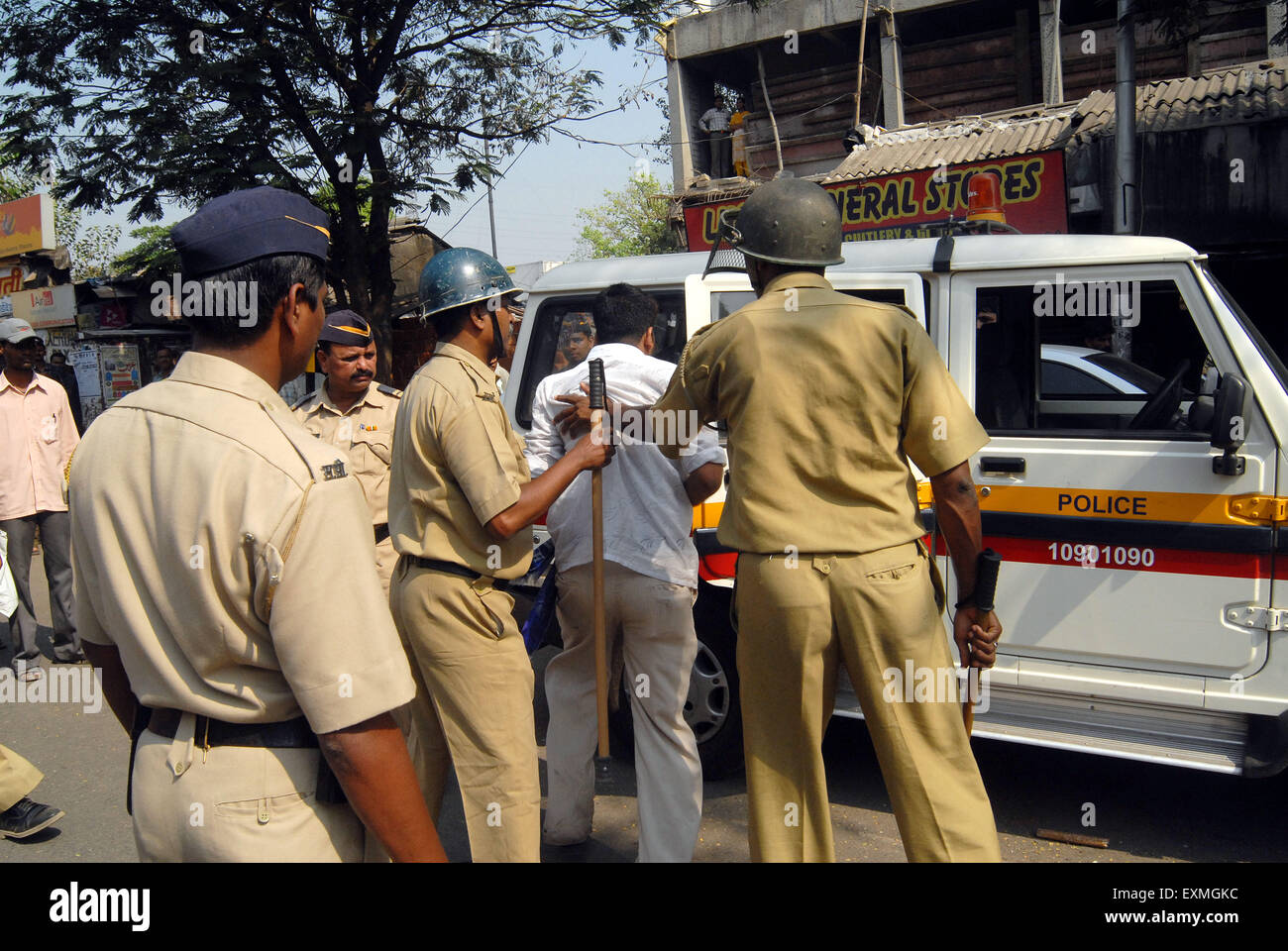 Man with lathi hi-res stock photography and images - Alamy