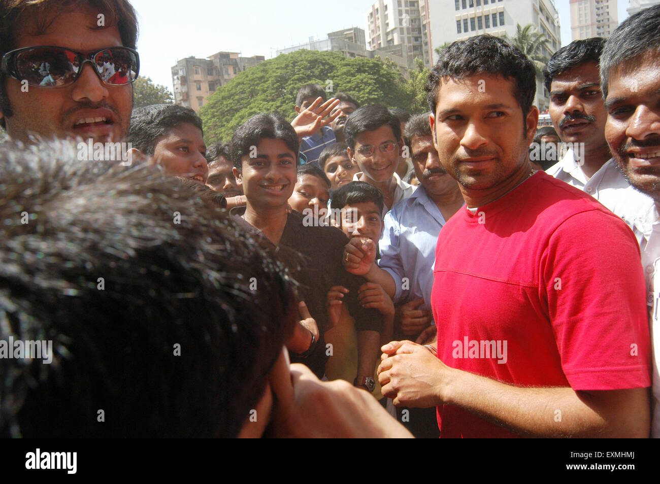 Indian cricket star Sachin Tendulkar is surrounded by his fans ; Bombay ...
