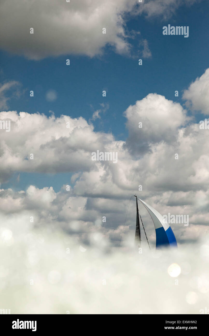 Sailing boat through clouds Stock Photo - Alamy