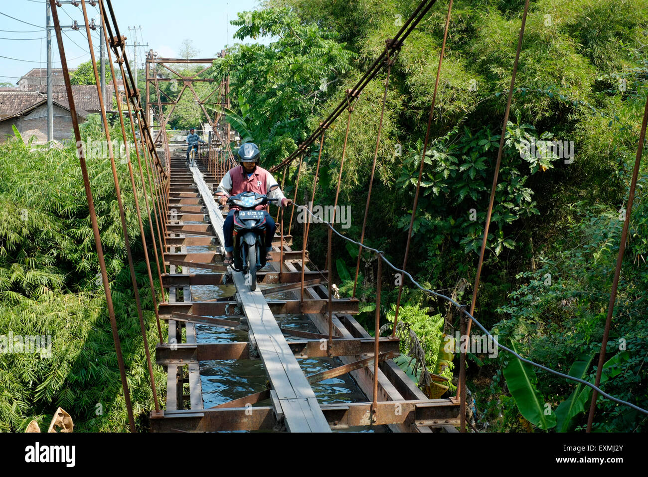 dangerous unstable bridge over ravine not designed for people is used ...