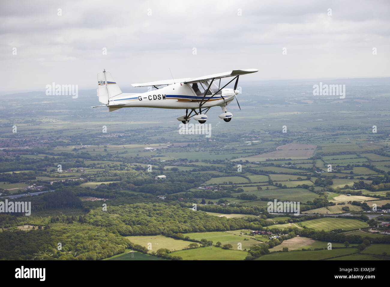 Aerial photograph of a microlight, a lightweight modern airplane, over ...
