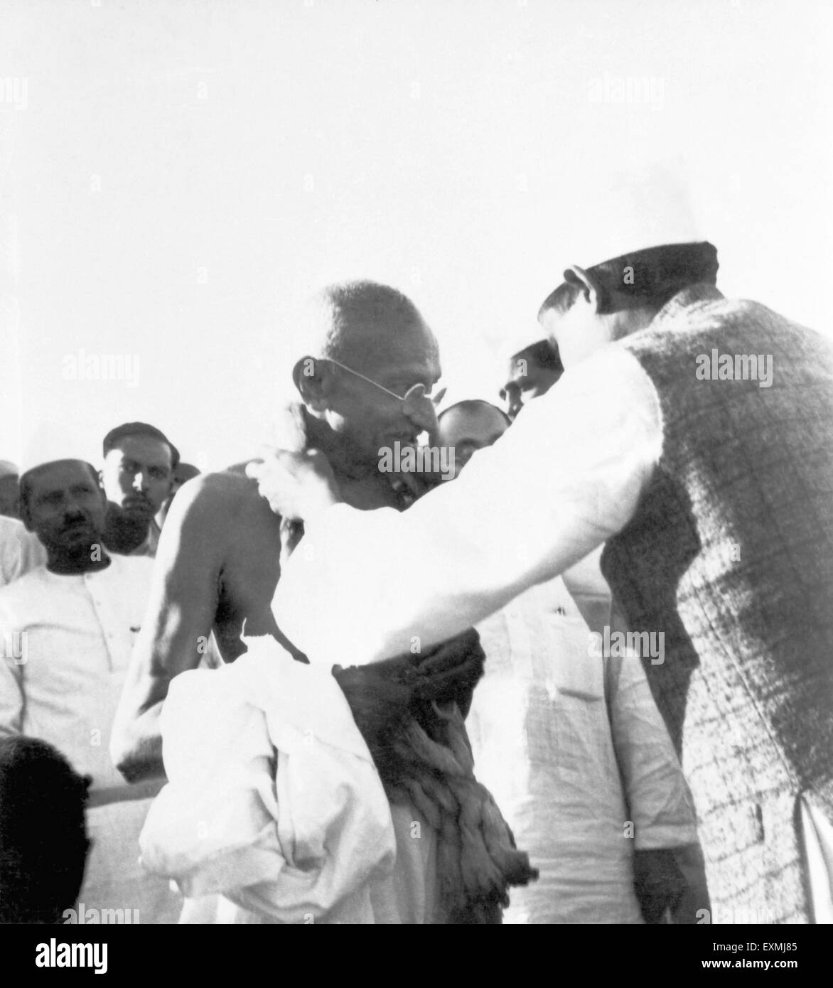 Mahatma Gandhi welcomed by someone with a khadi mala (cotton garland ...