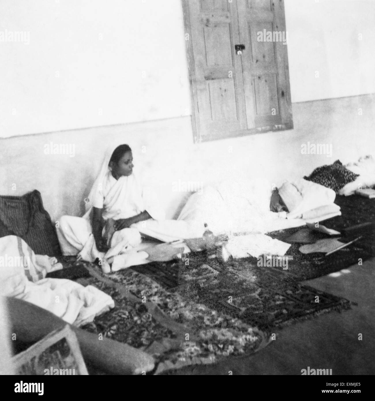 Amtus Salam massaging Mahatma Gandhi's feet during his visit to the ...