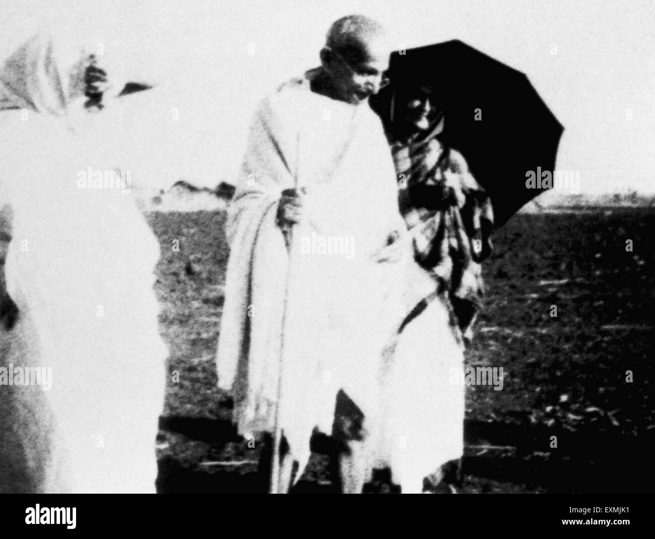 Mahatma Gandhi ; Rajkumari Amrit Kaur and others walking near Sevagram ...