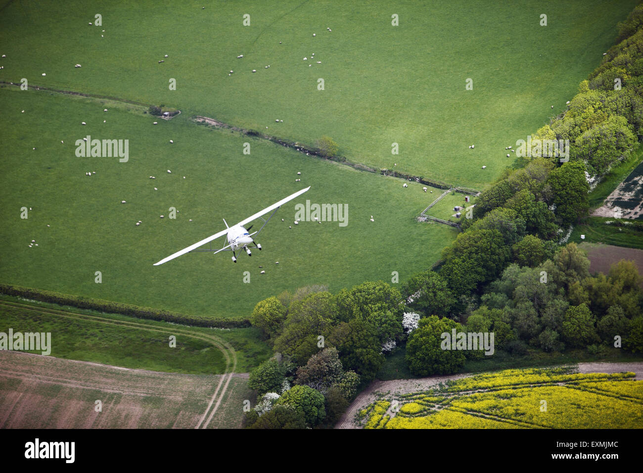 Aerial photograph of a microlight, a lightweight modern airplane, over ...