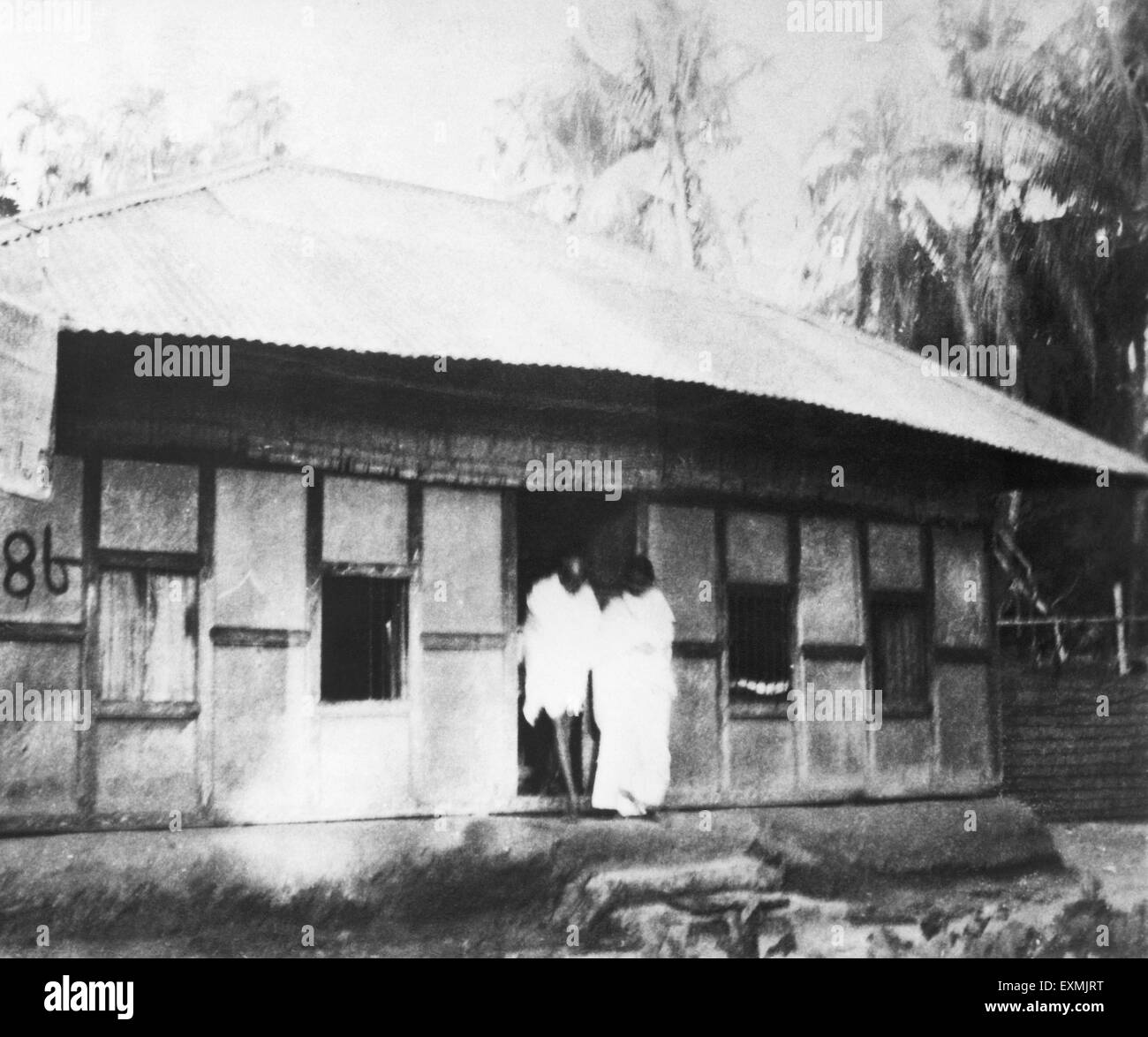 Mahatma Gandhi and Manu Gandhi leaving a hut in Noakhali East Bengal ...