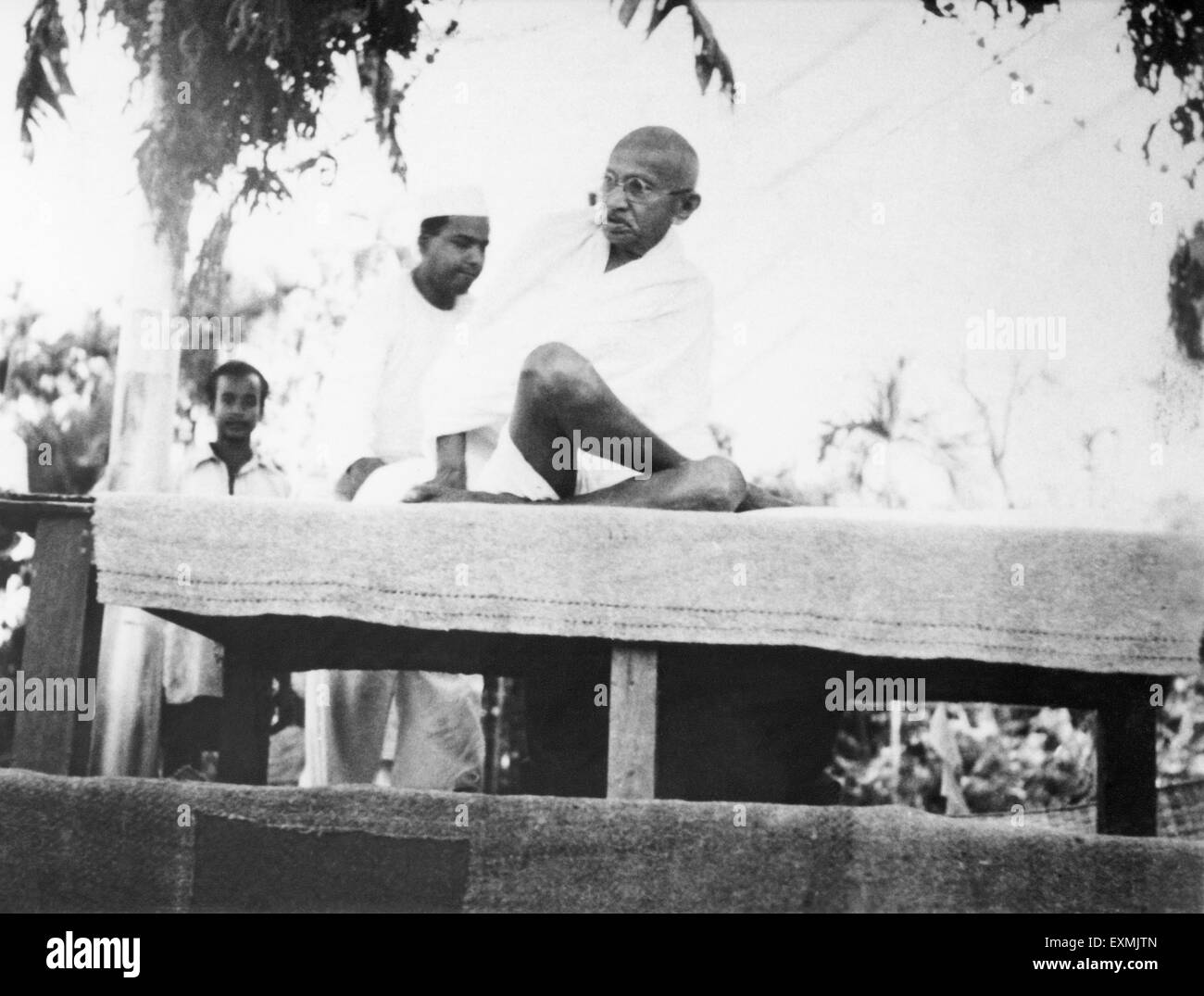 Mahatma Gandhi sitting on dais after the riots between Hindus and ...