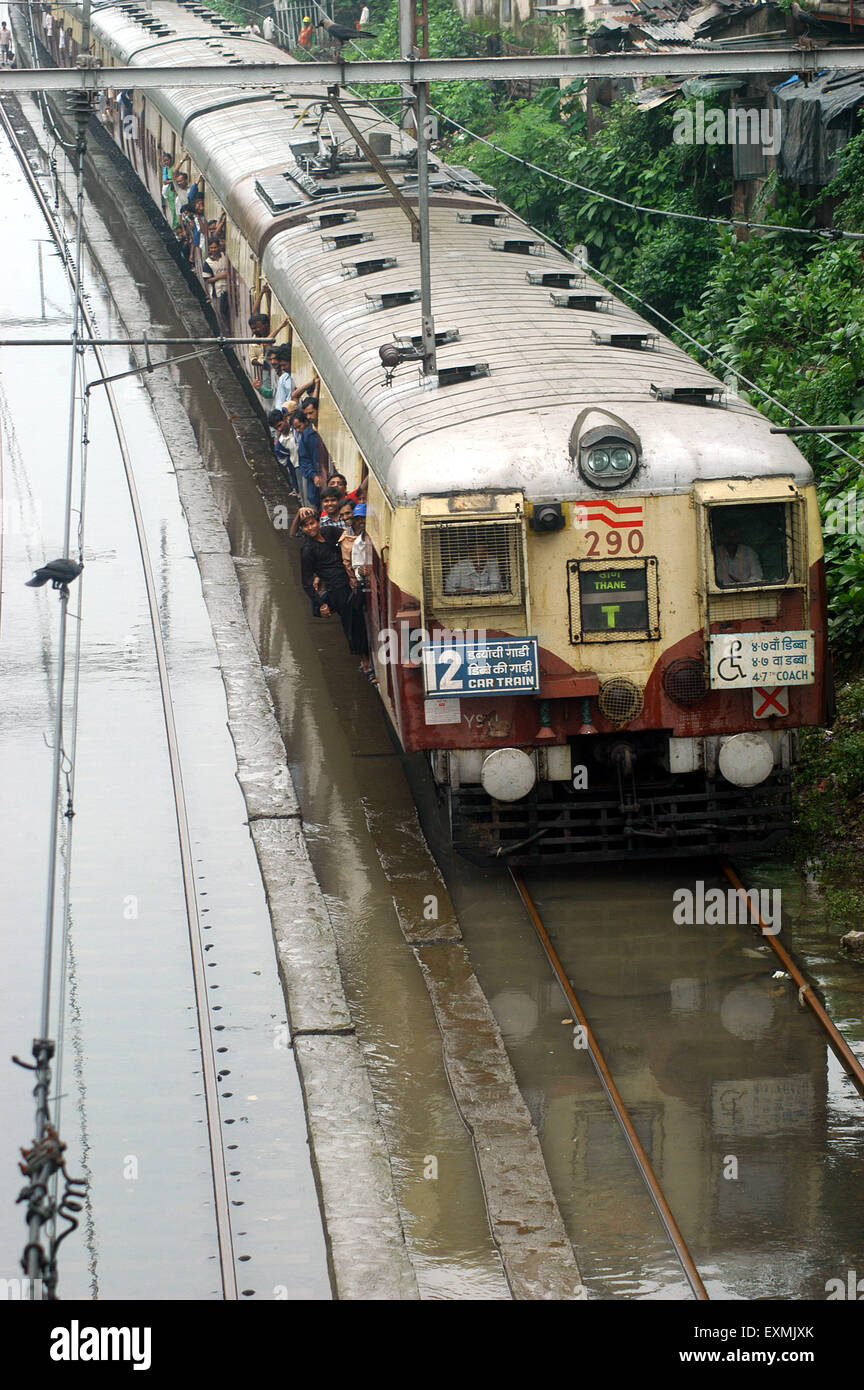 Monsoon rain floods, local train on flooded railway tracks, Bombay ...