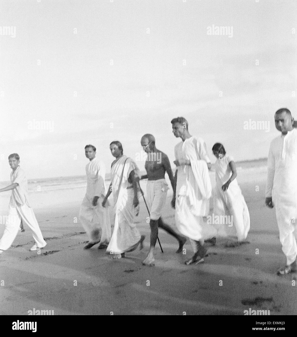 Mahatma Gandhi and others walking at Juhu Beach ; Mumbai ; May 1944 NO ...