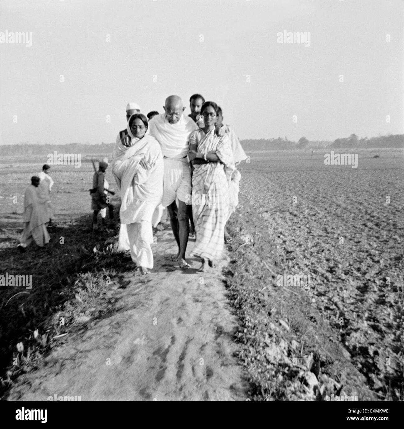 Mahatma Gandhi supported Amtus Salam Abha Gandhi walking Sachin Mitra ...